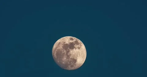 Full moon is moving across dark sky back... | Stock Video | Pond5