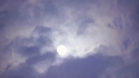 full moon moving between clouds with blu... | Stock Video | Pond5