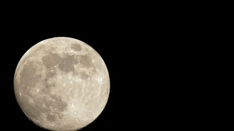 Full moon rising across the frame | Stock Video | Pond5