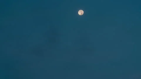 Full Moon setting in the blue morning sk... | Stock Video | Pond5