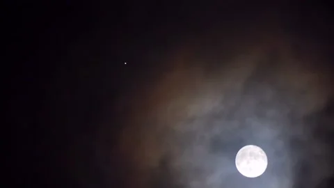 Full moon in the starless night sky | Stock Video | Pond5