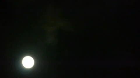 Full moon through cloudy,night flight ov... | Stock Video | Pond5
