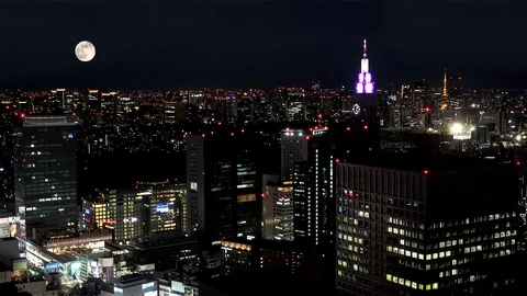 Full moon on the Tokyo skyline | Stock Video | Pond5