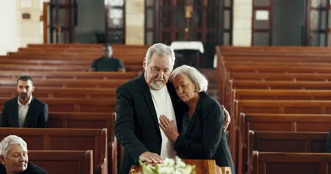 Funeral, church and couple hug by coffin... | Stock Video | Pond5