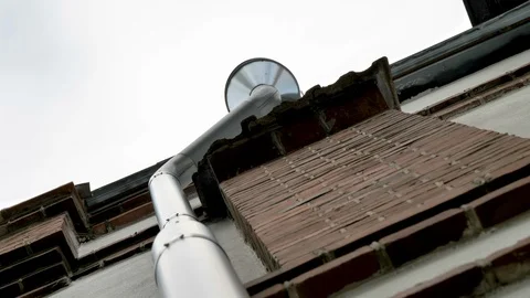 The funnel on the roof of the house with... | Stock Video | Pond5