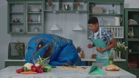 Funny big blue dinosaur eating African A... | Stock Video | Pond5