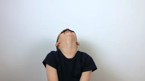 Funny boy with false moustache on grey b... | Stock Video | Pond5