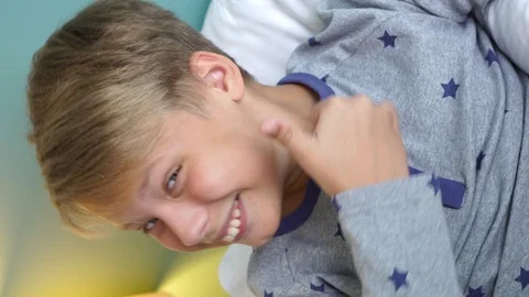 Funny boy looking at camera and showing ... | Stock Video | Pond5