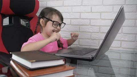 Funny child at the computer. Fast typing | Stock Video | Pond5