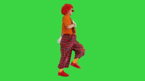 Funny clown walking like he is marching ... | Stock Video | Pond5