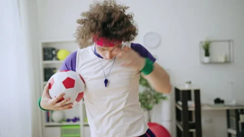 Funny curly-haired man cheering for foot... | Stock Video | Pond5