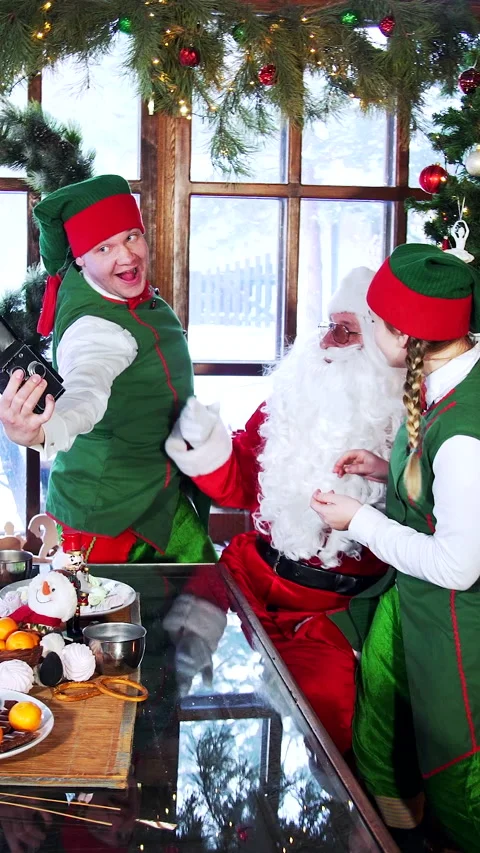 Funny elves and Santa in costumes in San... | Stock Video | Pond5