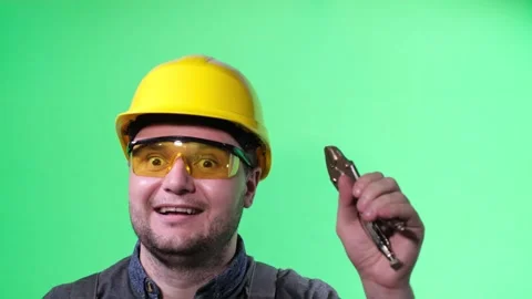 Funny engineer in helmet laughing at cam... | Stock Video | Pond5