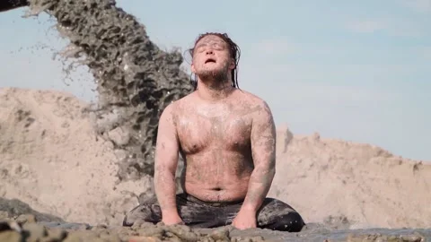 Funny Fat Man with Long Hair Sit Mud. ba... | Stock Video | Pond5