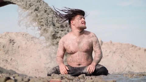 Funny Fat Man with Long Hair Sit Mud. ba... | Stock Video | Pond5