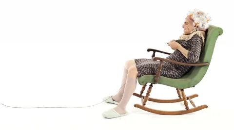 Funny grandmother is knitting on rocking... | Stock Video | Pond5