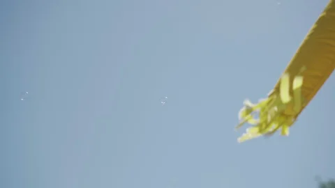 Funny inflatable man reeling in the wind | Stock Video | Pond5