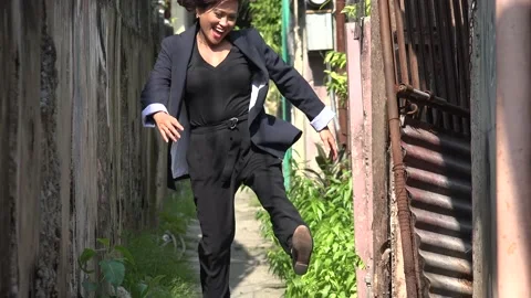 A Funny Jovial Woman Silly Walking | Stock Video | Pond5