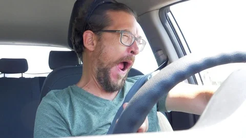 Funny man driving car ok sign dolly supe... | Stock Video | Pond5