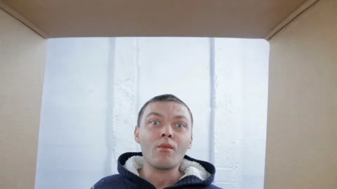Funny man opens a parcel box with differ... | Stock Video | Pond5