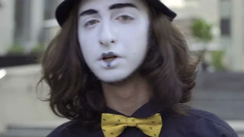 Funny mime touching his beard | Stock Video | Pond5