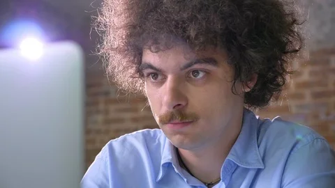 Funny nerd hacker typing on laptop and l... | Stock Video | Pond5