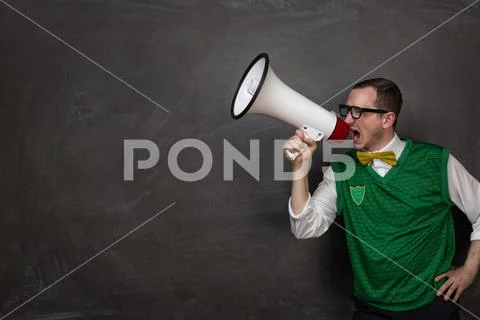 Funny retro nerd yelling through the megaphone with copy space Stock ...