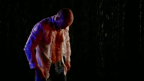 furious man is fighting with air in rain... | Stock Video | Pond5