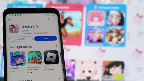 The gadget launches the mobile game Gach... | Stock Video | Pond5