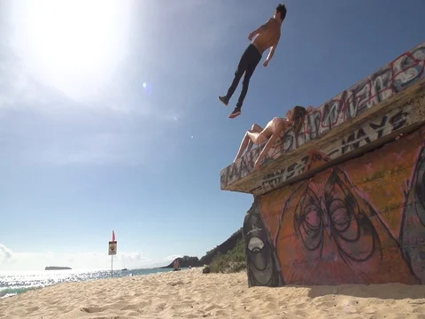 Gainer Flip over Bikini Girl on the Beac... | Stock Video | Pond5