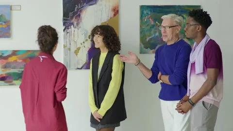 Gallery Guide Giving Tour to Visitors ar... | Stock Video | Pond5