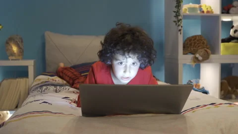 Game addicted boy playing games on lapto... | Stock Video | Pond5