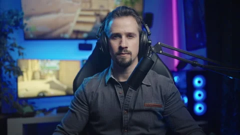 Gamer influencer looking at the camera i... | Stock Video | Pond5