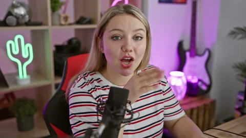 Gaming room gossip, blonde streamer capt... | Stock Video | Pond5