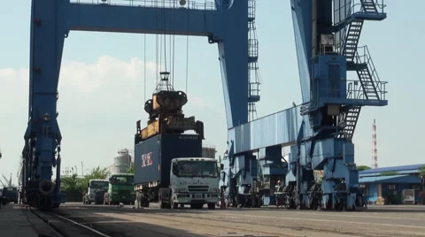 Gantry crane loading a container onto a ... | Stock Video | Pond5