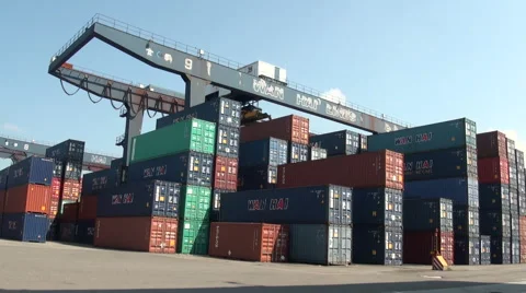 A gantry crane is stacking containers in... | Stock Video | Pond5