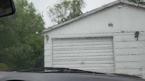 Garage in Rain outside of House | Stock Video | Pond5