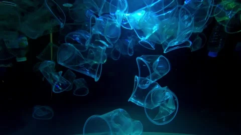 Garbage falling into the water floats ca... | Stock Video | Pond5