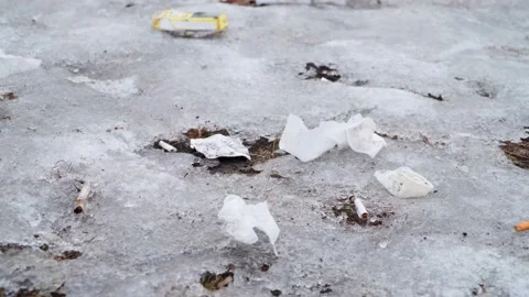 Garbage on the lake, spring. Cigarettes,... | Stock Video | Pond5