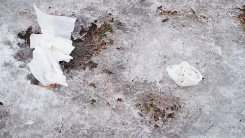 Garbage on the lake, spring. Cigarettes,... | Stock Video | Pond5