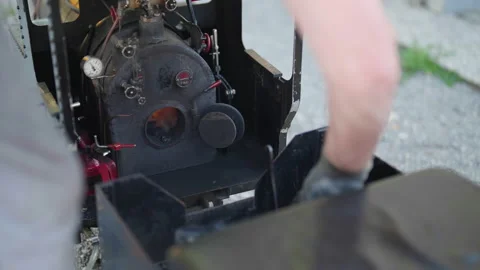 Garden steam locomotive engine loading b... | Stock Video | Pond5