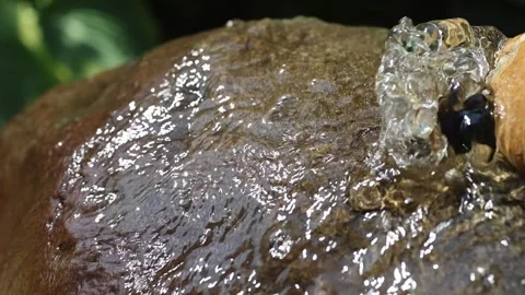 Garden well with bubbling and sparkling ... | Stock Video | Pond5