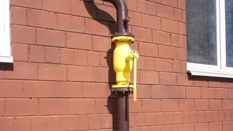Gas pipe with valve on the building wall | Stock Video | Pond5
