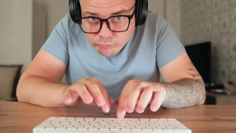 Geek funny man programmer looking at cam... | Stock Video | Pond5