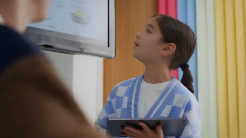 Gen Alpha Asian Girl Making Report durin... | Stock Video | Pond5