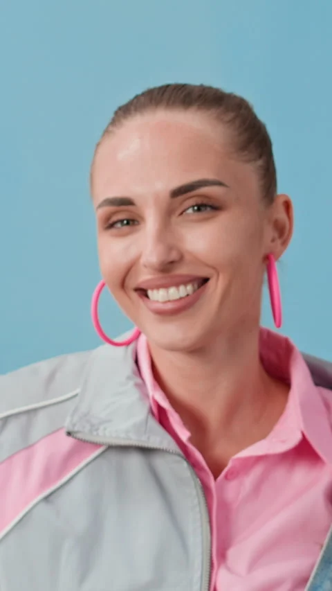 Gen Y Woman in 90s Outfit Blowing Kiss o... | Stock Video | Pond5