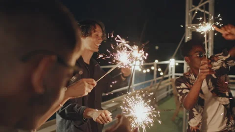 Gen Z Friends Dancing With Sparklers At ... | Stock Video | Pond5