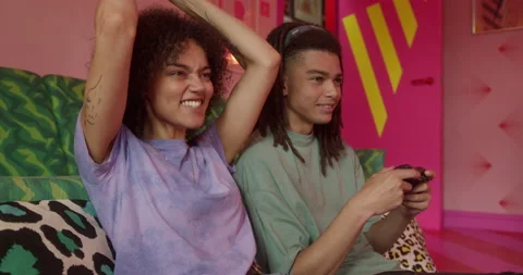 Gen Z friends playing a video game with ... | Stock Video | Pond5