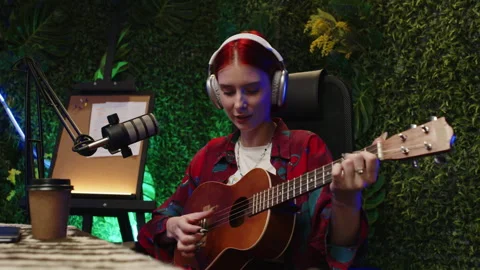 Gen Z Girl Playing Guitar and Singing in... | Stock Video | Pond5