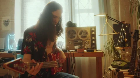 Gen Z Guy Playing Electric Guitar in Coz... | Stock Video | Pond5